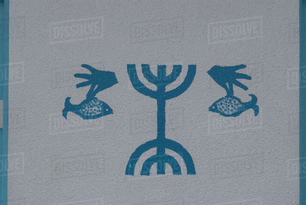 Traditional good luck symbols and menorah on the front of a residence ...