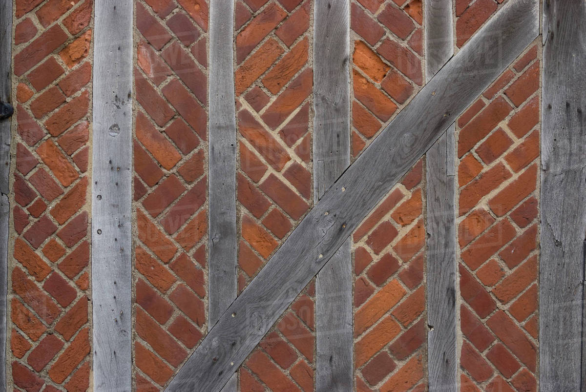 Detail of diagonally oriented bricks and timber frame - Royalty-free ...