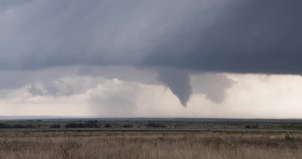 Cone-shaped tornado tracks across prairie from right to left, 4K. - 4K ...