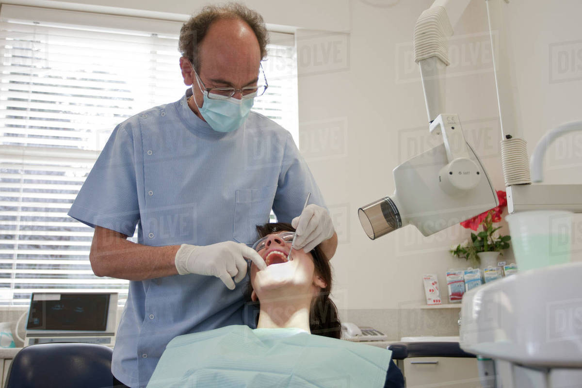 Dentist at work - Royalty-free Stock Photo | Dissolve