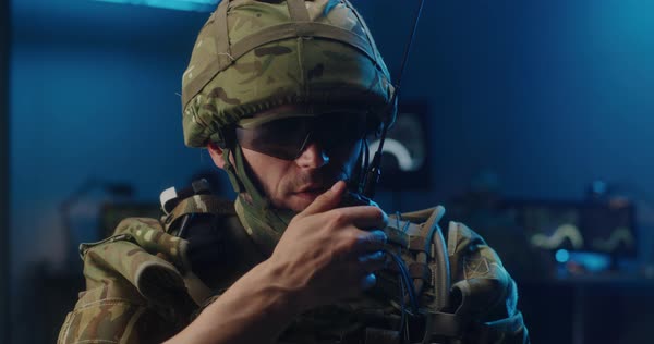 Medium close-up of a soldier talking into a walkie-talkie - 4K Royalty ...