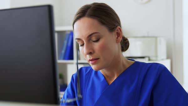 Tired doctor with computer working at hospital - 4K Royalty-free Stock ...