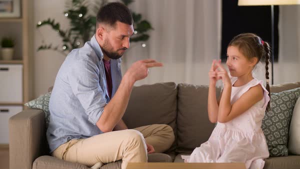 Father and daughter playing clapping game at home - 4K Royalty-free ...