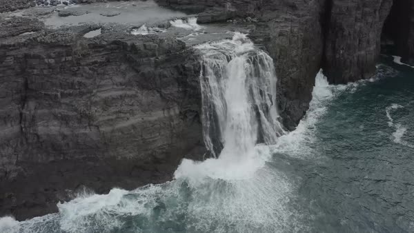 Aerial shot of waterfall falling from cliff - Stock Video Footage ...