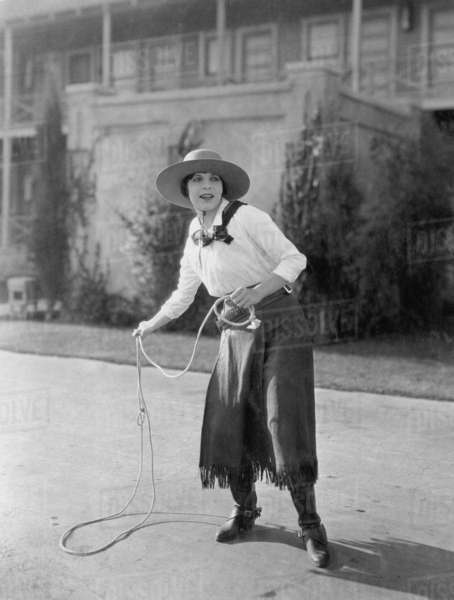 Cowgirl using lasso - Royalty-free Stock Photo | Dissolve