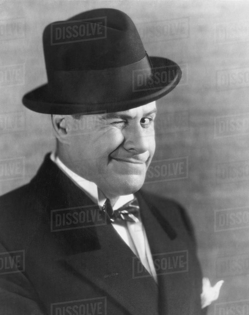 Portrait of man winking - Royalty-free Stock Photo | Dissolve