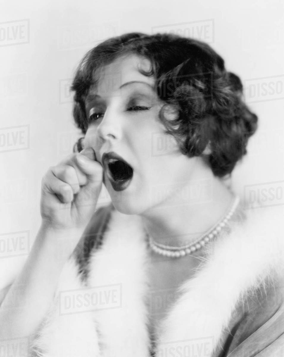 Woman yawning - Royalty-free Stock Photo | Dissolve