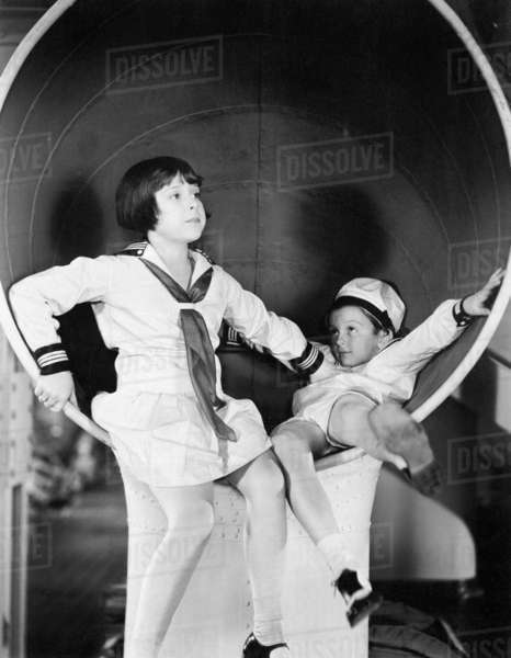 Teacher spanking a girl in a classroom - Stock Photo - Dissolve