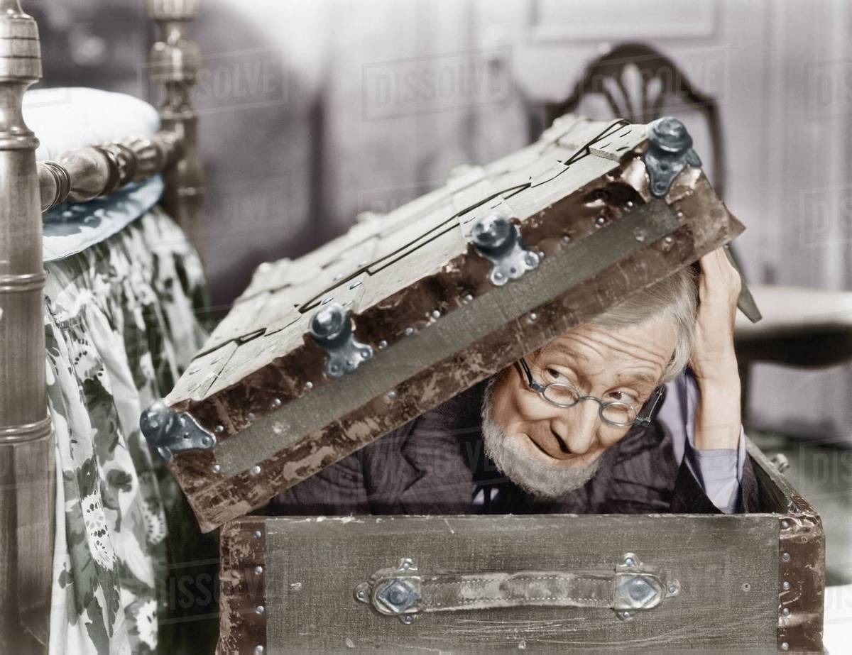 Man peaking out of a trunk - Royalty-free Stock Photo | Dissolve