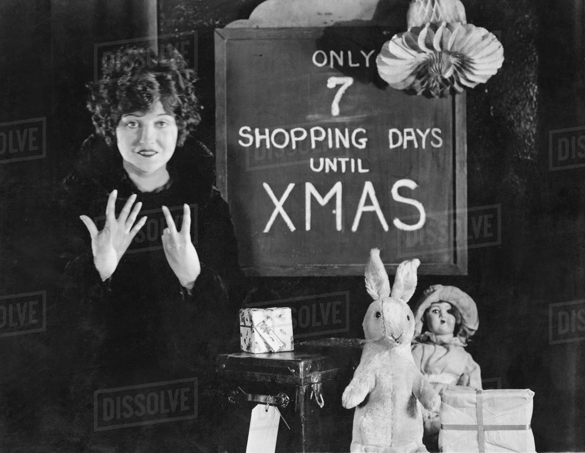 Woman and sign with number of shopping days until Christmas - Stock ...