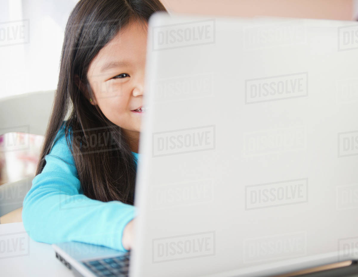 Korean girl using laptop - Royalty-free Stock Photo | Dissolve