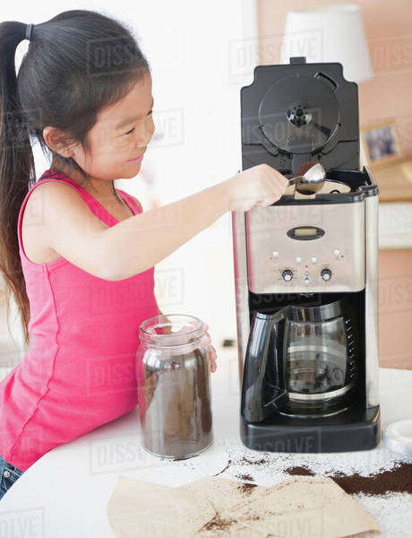 Korean girl making coffee - Royalty-free Stock Photo | Dissolve