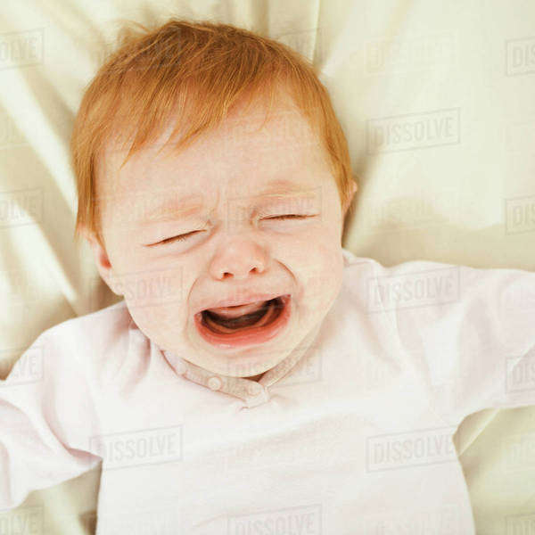 Crying Caucasian baby girl - Royalty-free Stock Photo | Dissolve