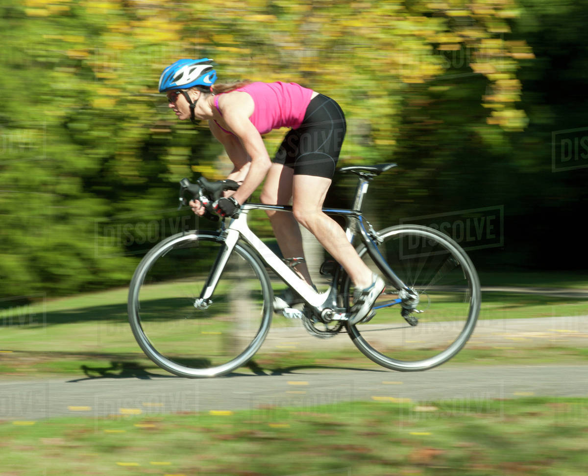 Caucasian woman riding bicycle in park - Royalty-free Stock Photo ...
