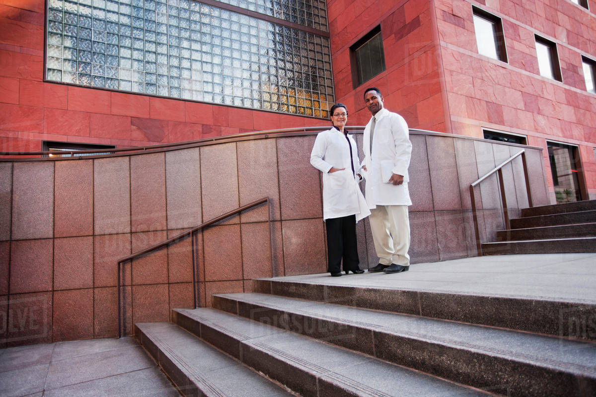 Doctors standing outdoors - Royalty-free Stock Photo | Dissolve