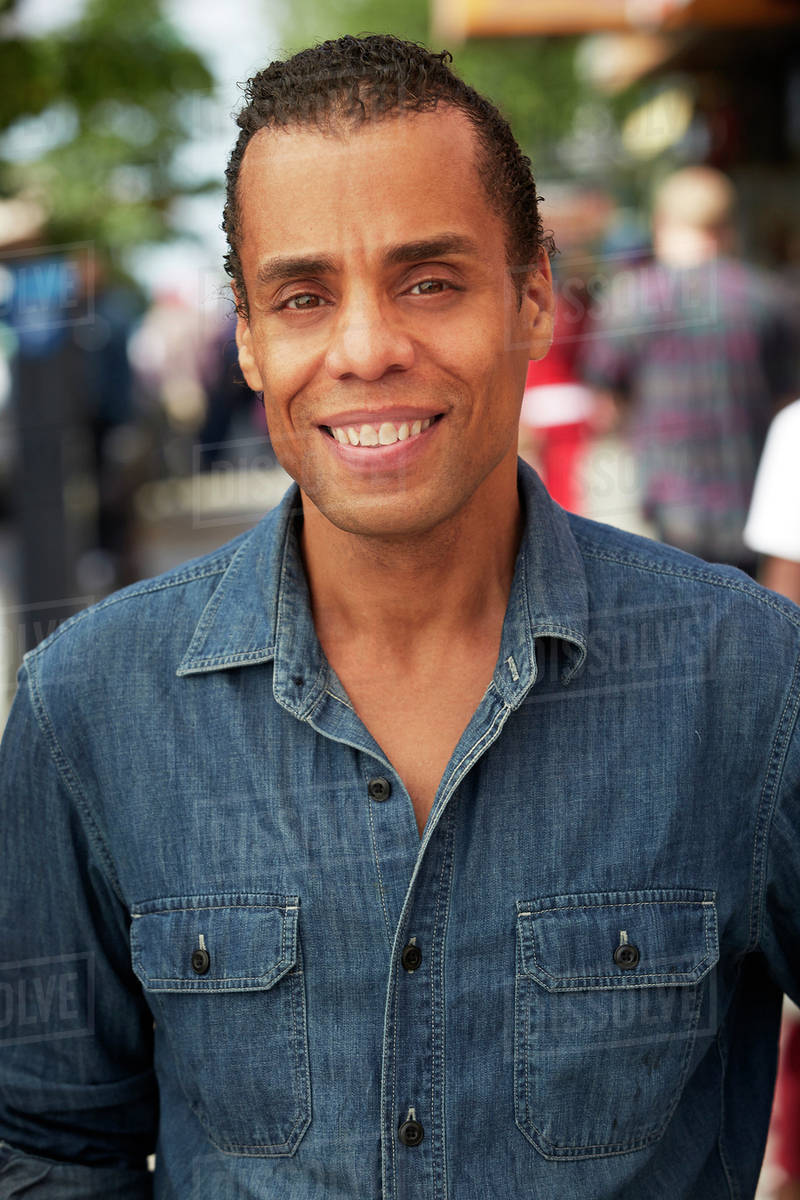 Mixed race man smiling - Royalty-free Stock Photo | Dissolve