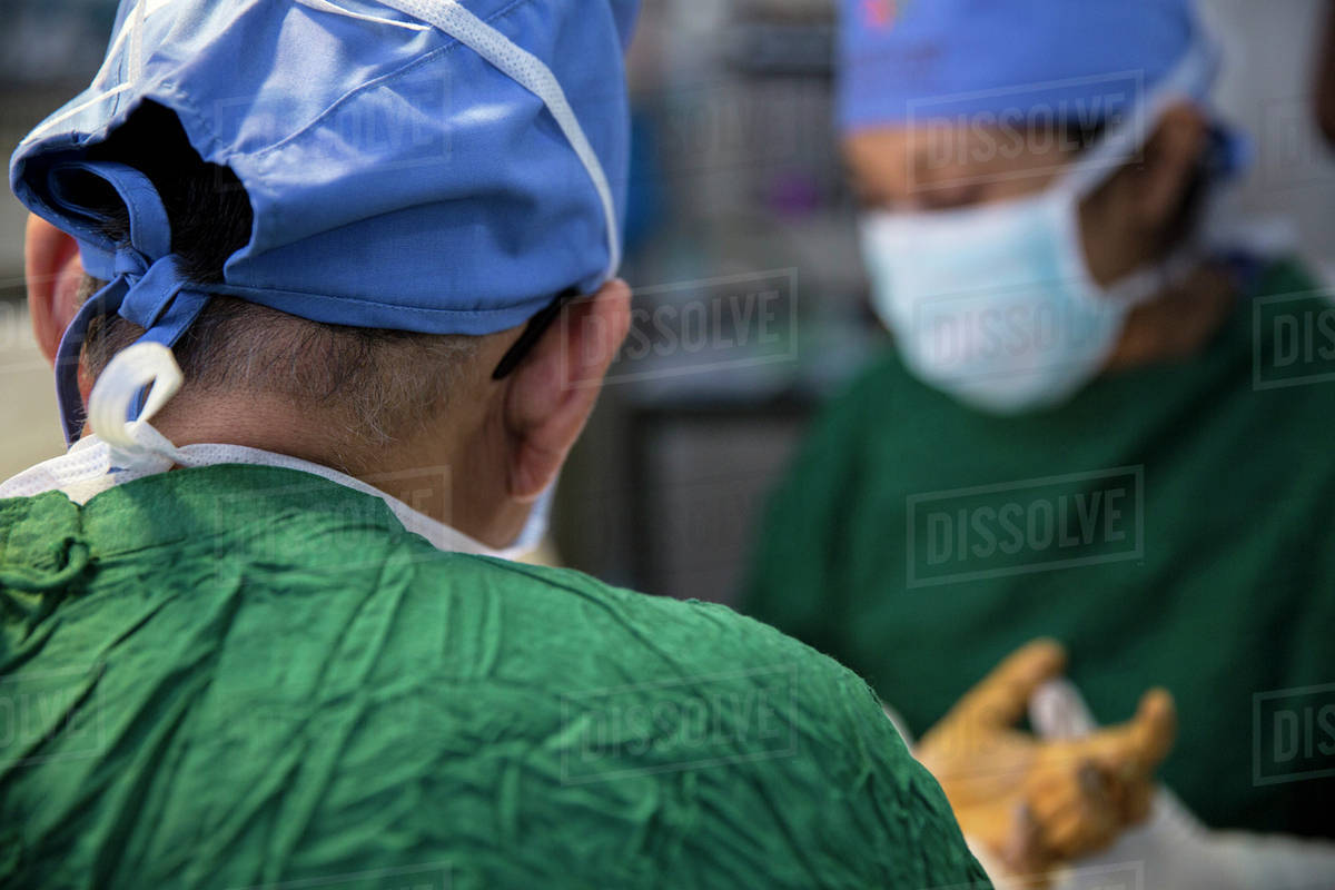 Surgeon working in operating room - Royalty-free Stock Photo | Dissolve