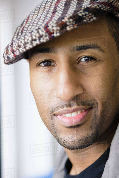 African American man wearing cap - Royalty-free Stock Photo | Dissolve