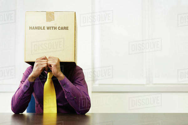 Black businessman with box over his head - Royalty-free Stock Photo ...