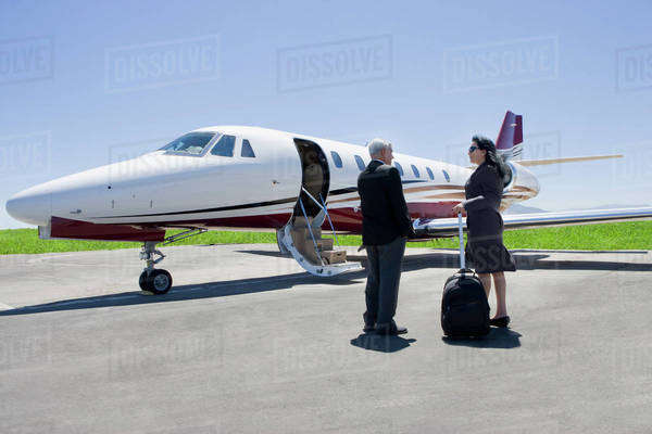 Business people boarding private jet - Royalty-free Stock Photo | Dissolve