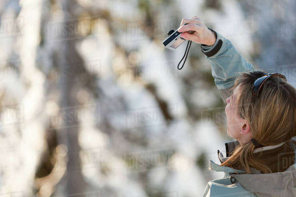 Caucasian woman taking photograph with digital camera - Royalty-free ...
