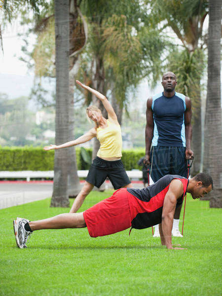 People exercising in park together - Royalty-free Stock Photo | Dissolve