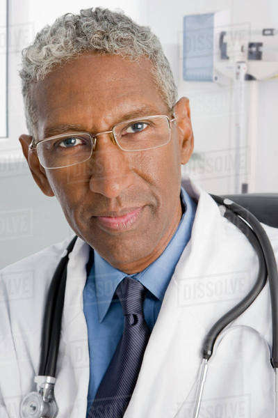 Serious mixed race doctor - Royalty-free Stock Photo | Dissolve