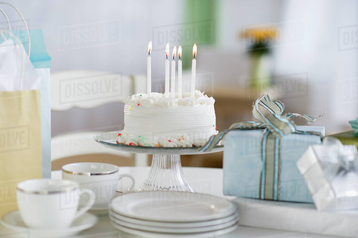 Birthday cake, gifts with plates and cups - Royalty-free Stock Photo ...