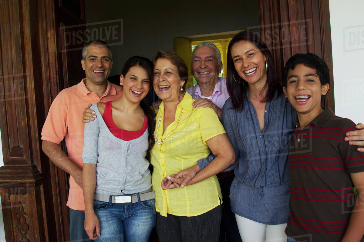 Hispanic family standing in doorway together - Royalty-free Stock Photo ...