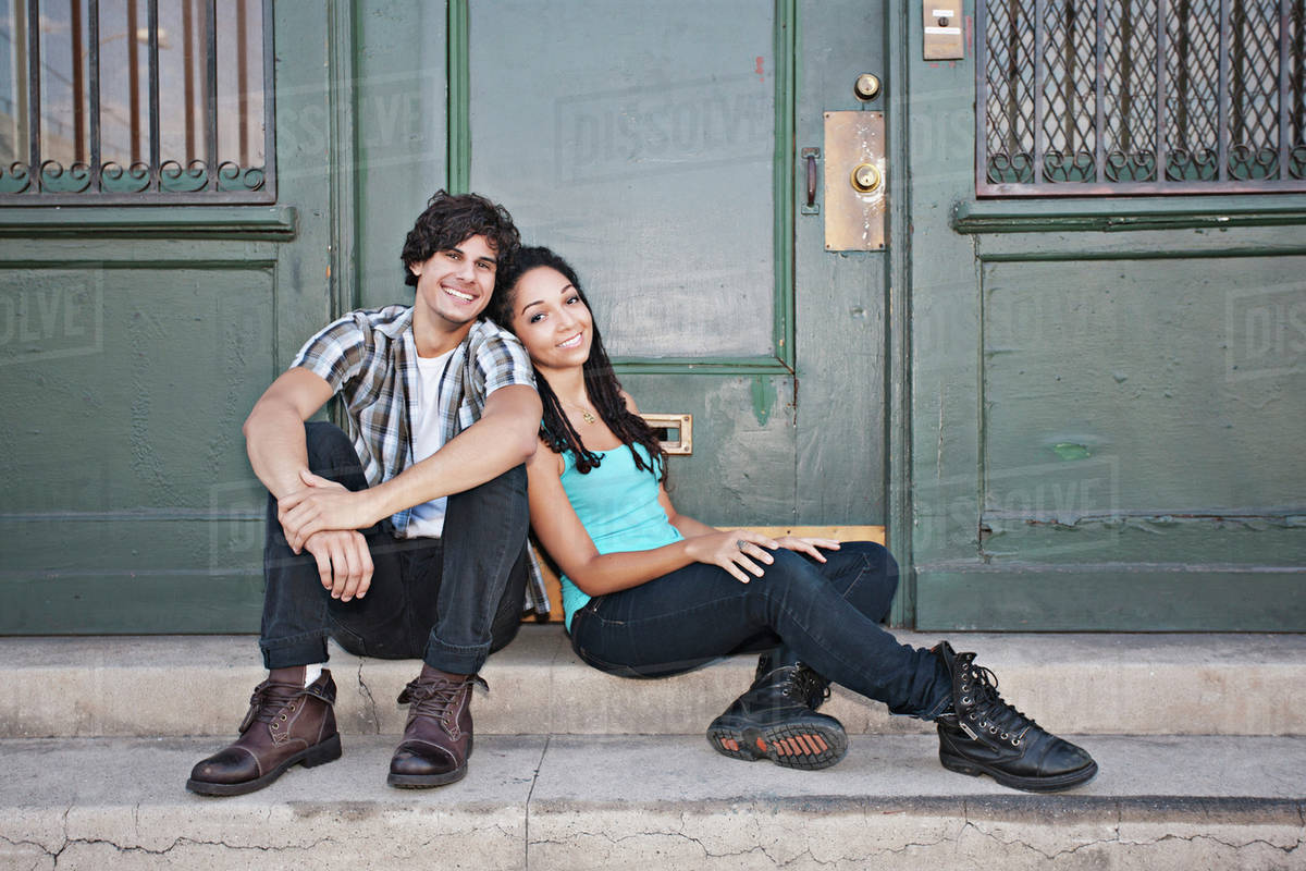 Couple leaning on each other on front stoop - Royalty-free Stock Photo ...