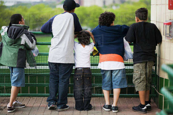 Boys leaning against railing - Royalty-free Stock Photo | Dissolve