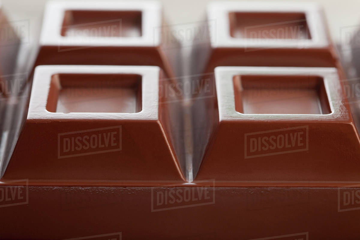Close up of bar of chocolate - Royalty-free Stock Photo | Dissolve