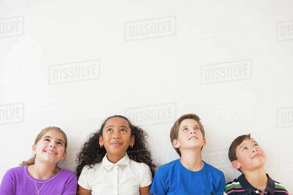 Smiling children thinking and looking up - Royalty-free Stock Photo ...