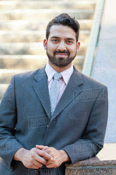 Indian businessman smiling outdoors - Royalty-free Stock Photo | Dissolve