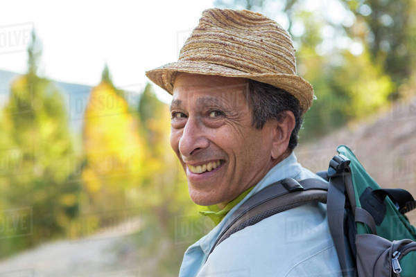 Man exploring autumn forest - Royalty-free Stock Photo | Dissolve