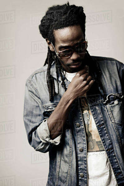 Black man looking down - Royalty-free Stock Photo | Dissolve