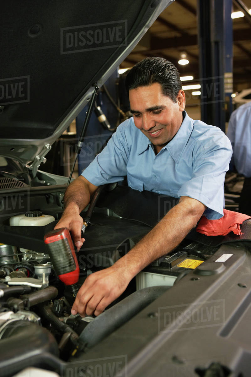 Indian male auto mechanic in shop - Royalty-free Stock Photo | Dissolve