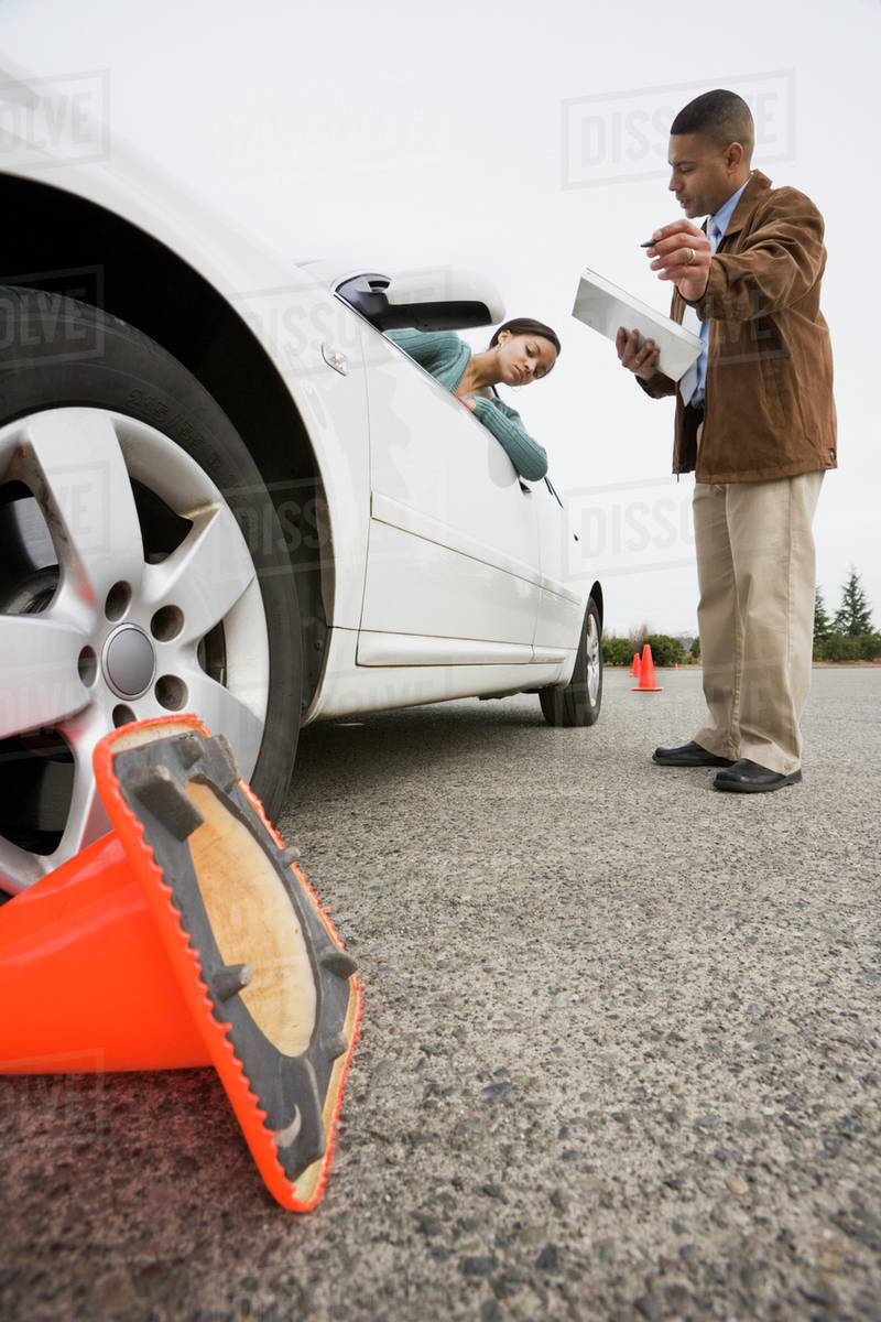 African teenager running over traffic cone at drivers test - Royalty ...