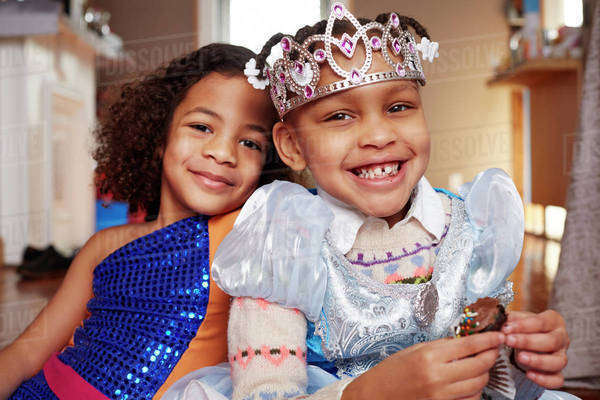 Smiling girls playing dress-up - Royalty-free Stock Photo | Dissolve