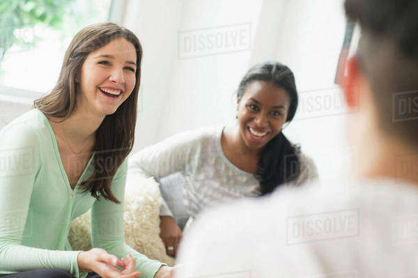 Smiling friends talking - Royalty-free Stock Photo | Dissolve