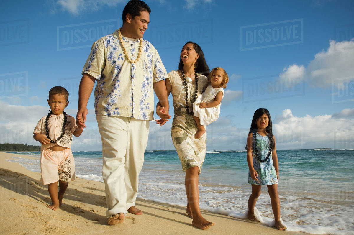 Pacific Islander family walking on beach - Royalty-free Stock Photo ...