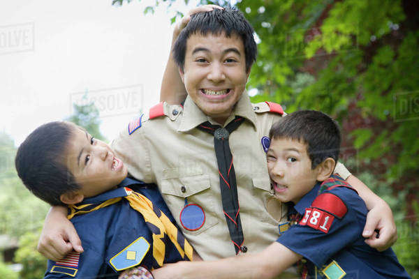 Asian brothers hugging - Royalty-free Stock Photo | Dissolve