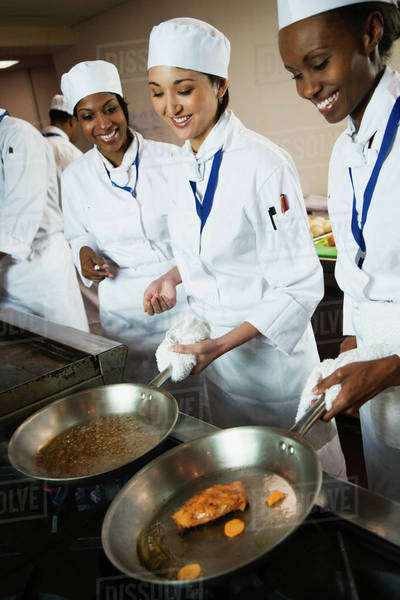 Multi-ethnic chefs preparing food - Stock Photo - Dissolve