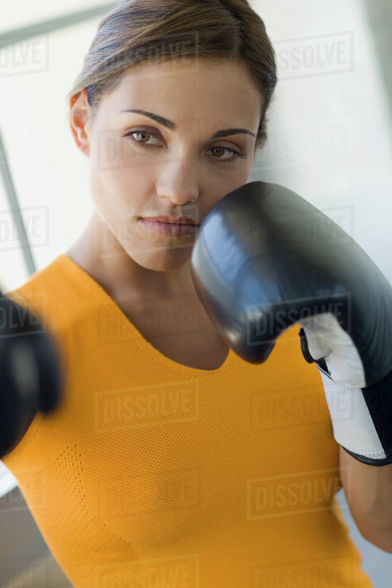 Mixed race woman boxing - Stock Photo - Dissolve
