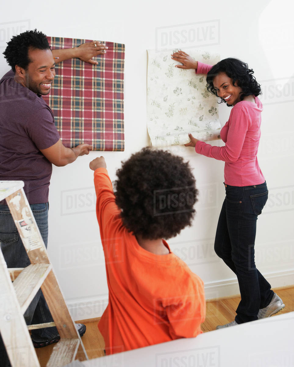 African son helping parents choose wallpaper - Royalty-free Stock Photo ...