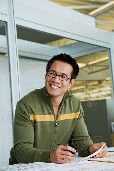 Asian American businessman working in office - Royalty-free Stock Photo ...