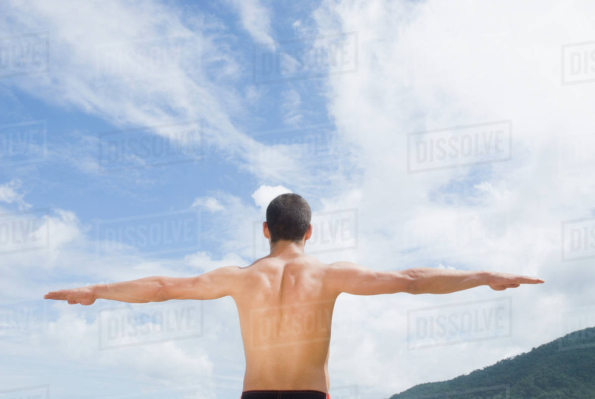 Bare chested Hispanic man with arms out - Royalty-free Stock Photo ...