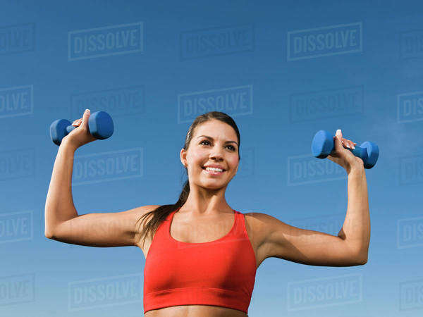 Native American woman lifting hand weights - Royalty-free Stock Photo ...