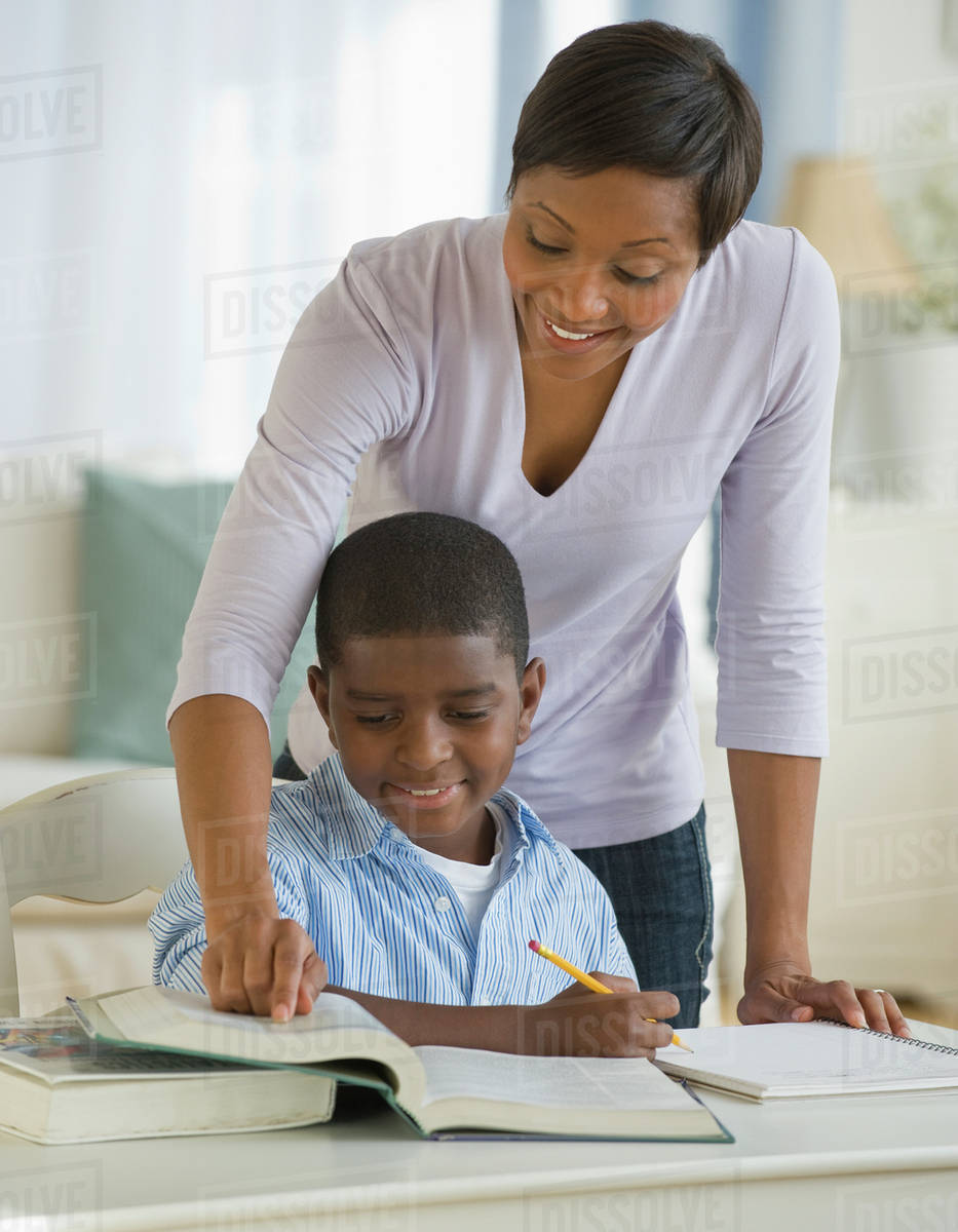 African mother helping son with homework - Royalty-free Stock Photo ...