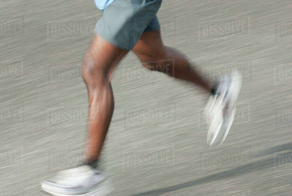 Blurred runner's legs running - Royalty-free Stock Photo | Dissolve